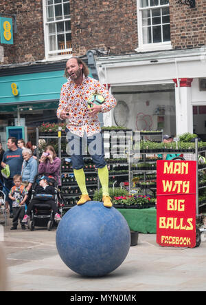 Man with Big Balls street entertainer gathers money from his audience ...