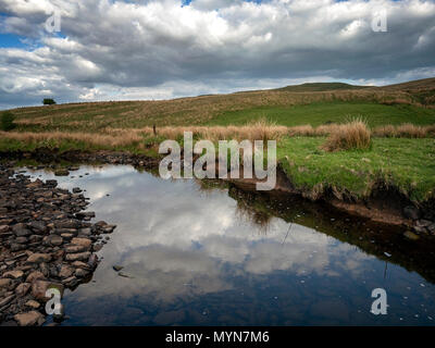 Dramatic skies over the river Hepste (Afon Hepste) at Tir-yr-onen, near ...