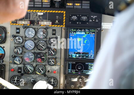 Inside the cockpit of a Skybus Twin-Otter en route to St Marys, Isles ...