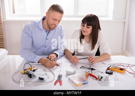 Young male architect working at the project Stock Photo - Alamy