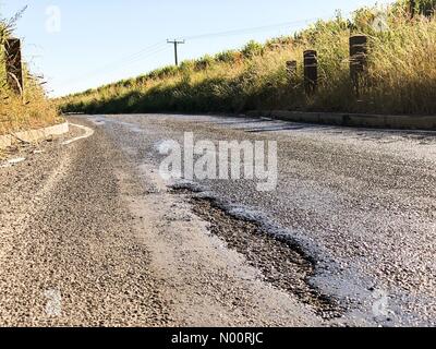 Godalming, UK. 26th Jun, 2018. UK Weather: Melted roads in Godalming ...
