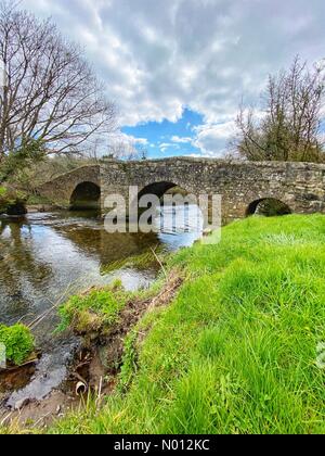 Ashton, Devon, UK. 1st April, 2020. Pretty Ashton Bridge over River ...