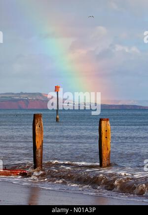 UK Weather: Rainbow at Teignmouth beach, Devon, UK. 5 Jan, 2024. Credit ...