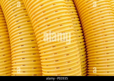full frame detail of a rolled yellow drainage pipe Stock Photo - Alamy