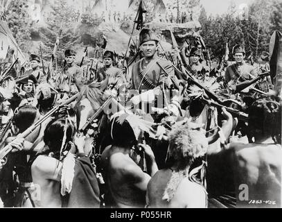 . English: North-West Mounted Police posed in front of log cabin ...