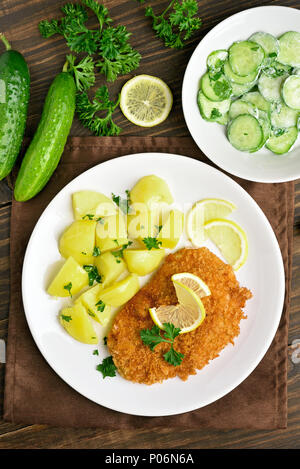 Raw breaded chicken schnitzel for roast Stock Photo - Alamy