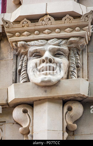 Stone faces on the corner of a building Stock Photo - Alamy