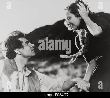 MERLE OBERON and LAURENCE OLIVIER on set candid in the grounds of Denham Studios during a break ...