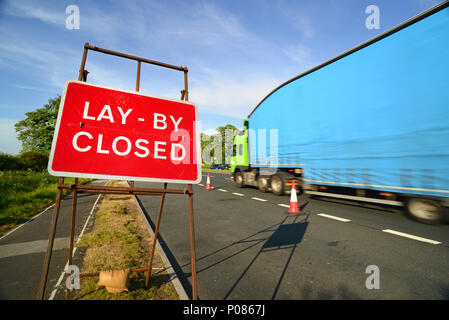 lorry paasing closed lay by sign leeds united kingdom Stock Photo - Alamy
