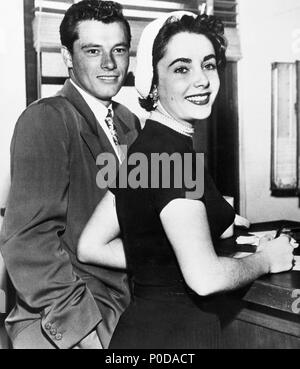 Stars: ELIZABETH TAYLOR; NICHOLAS CONRAD "NICKY" JR. HILTON Stock Photo ...