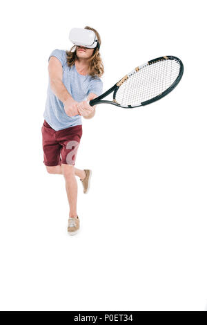 handsome young man in virtual reality headset holding skis and ski ...