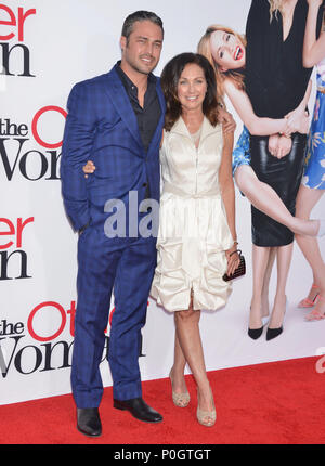 Taylor Kinney and mom at theThe Other Woman Premiere at the Westwood ...
