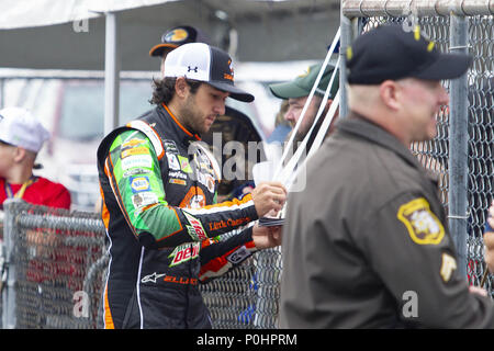 Driver Chase Elliott signs autographs for fans before a NASCAR Cup ...