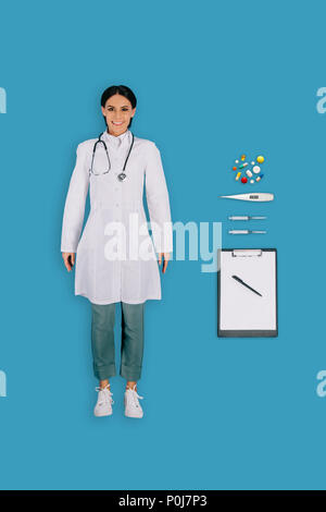 Female doctor with syringes on blue background Stock Photo - Alamy