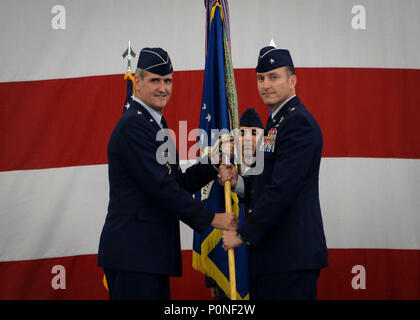 Brig. Gen. Robert Novotny, 57th Wing commander, passes the guidon to ...