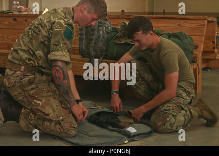 A paratrooper of the British Army Parachute Regiment with a L1A1 12.7mm ...