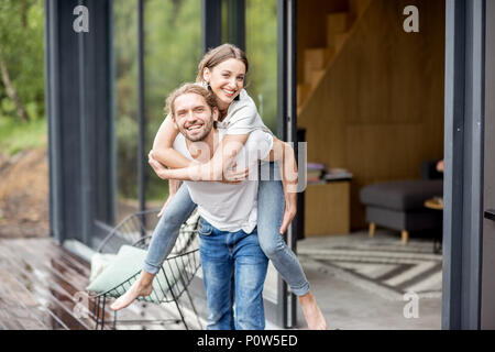 Couple on the terrace of the modern house Stock Photo - Alamy