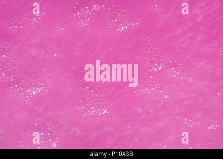 pink washing liquid with bubbles background Stock Photo - Alamy