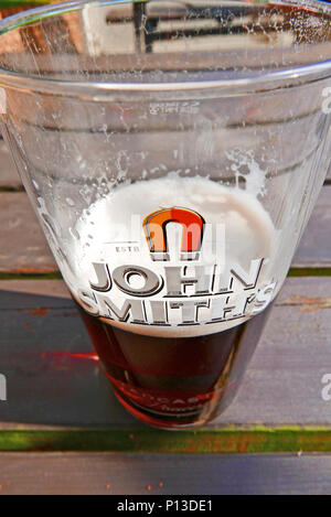 A pint of John Smiths beer on a table in a pub restaurant Stock Photo ...