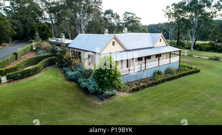 Australian colonial sandstone brick cottage house with verandah, tin ...