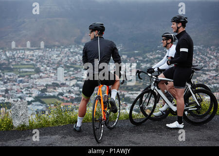 young man taking bicycle from automated bicycle sharing system Stock ...
