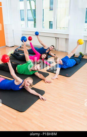 Workout group in gymnasium during physiotherapy Stock Photo - Alamy