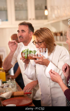 Chef smelling food in commercial kitchen at restaurant Stock Photo - Alamy