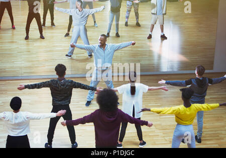 Male instructor leading dance class in studio Stock Photo - Alamy