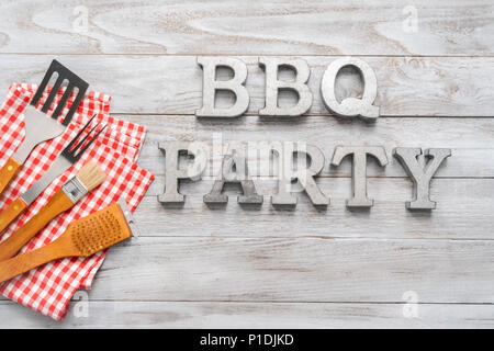 BBQ Party sign with BBQ cooking tools on a wood background Stock Photo ...