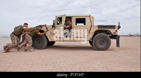 Marines push a Humvee during a squad competition Nov. 26 at Camp Stock ...