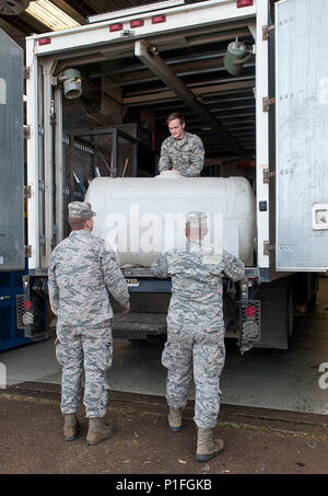 Airmen from the 91st Missile Maintenance Squadron raise a transport ...