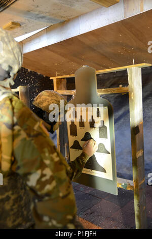 U.S. Army Sgt. Jerrell Knight, with 128th Signal Company, simulates ...