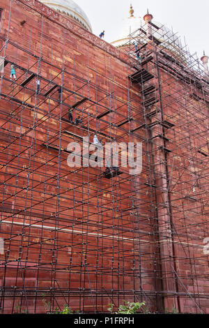 The Taj Mahal with construction on one of its pillars is seen during a ...