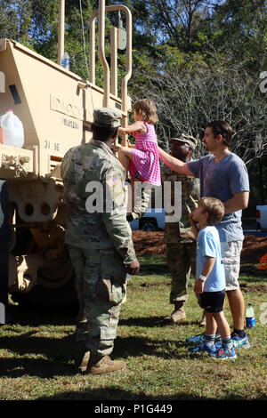 Rocky, the 3rd Infantry Division mascot, poses with a statue of himself ...