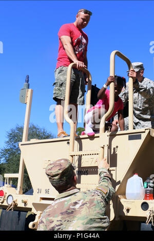 Rocky, the 3rd Infantry Division mascot, poses with a statue of himself ...