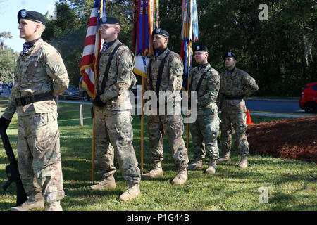 Rocky, the 3rd Infantry Division mascot, poses with a statue of himself ...