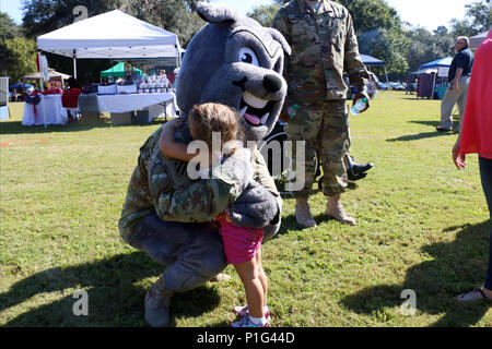 Rocky, the 3rd Infantry Division mascot, poses with a statue of himself ...