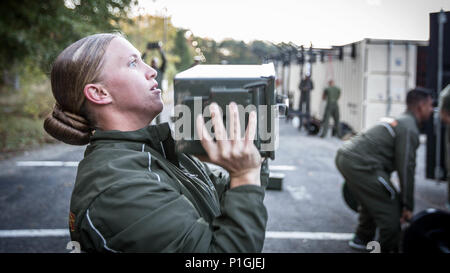 Force Fitness Instructor (FFI) student executes proper ammo can lift ...