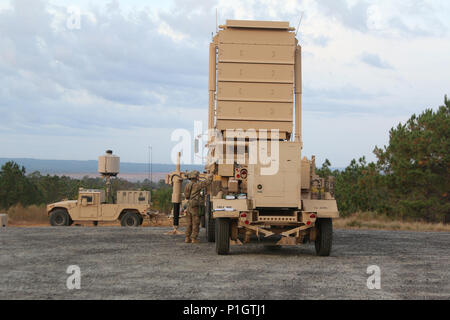 An Army Soldier of the 18th Fires Brigade directs a Marine Heavy Stock ...