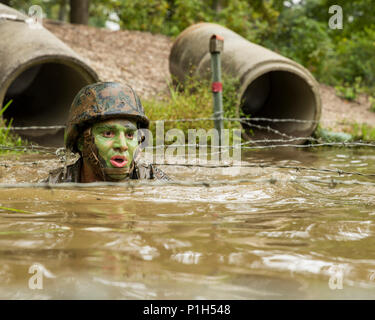 A candidate with the Officer Candidate School (OCS) swims through the ...