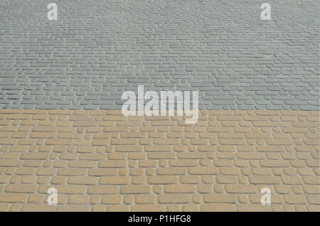 A detailed photo of the square, laid out of modern paving stone with ...
