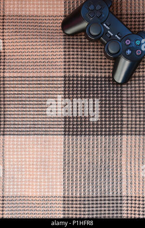 Modern joystick on beige background Stock Photo - Alamy