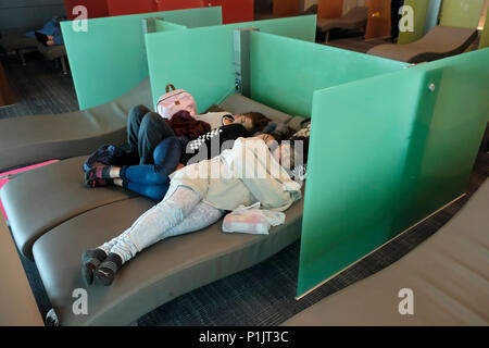 Sleeping transit passengers in airport terminal at Changi Airport in ...