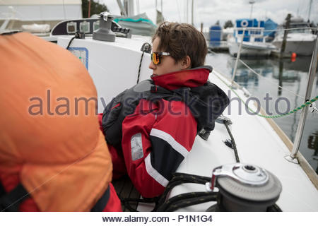 Boys resting on boat Stock Photo: 33801799 - Alamy