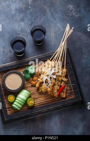 Top view of chicken Satay of seasoned, skewered, and grilled meat ...