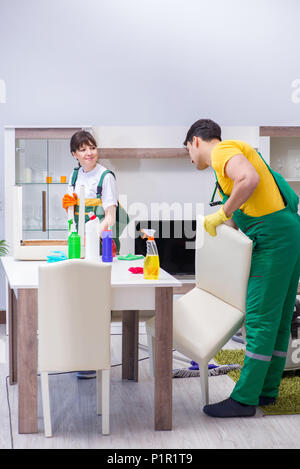 Cleaning professional contractors working at house Stock Photo - Alamy