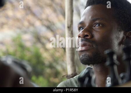 Director Phillip Noyce with Derek Luke on the set Catch a Fire Year ...