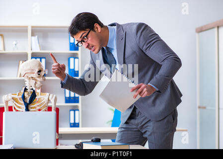 Angry boss yelling at his skeleton employee Stock Photo - Alamy