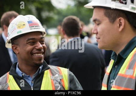 Attendees at the groundbreaking ceremony for the redevelopment of Cook ...