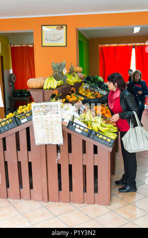 Nice woman on shopping in clothes store Stock Photo - Alamy